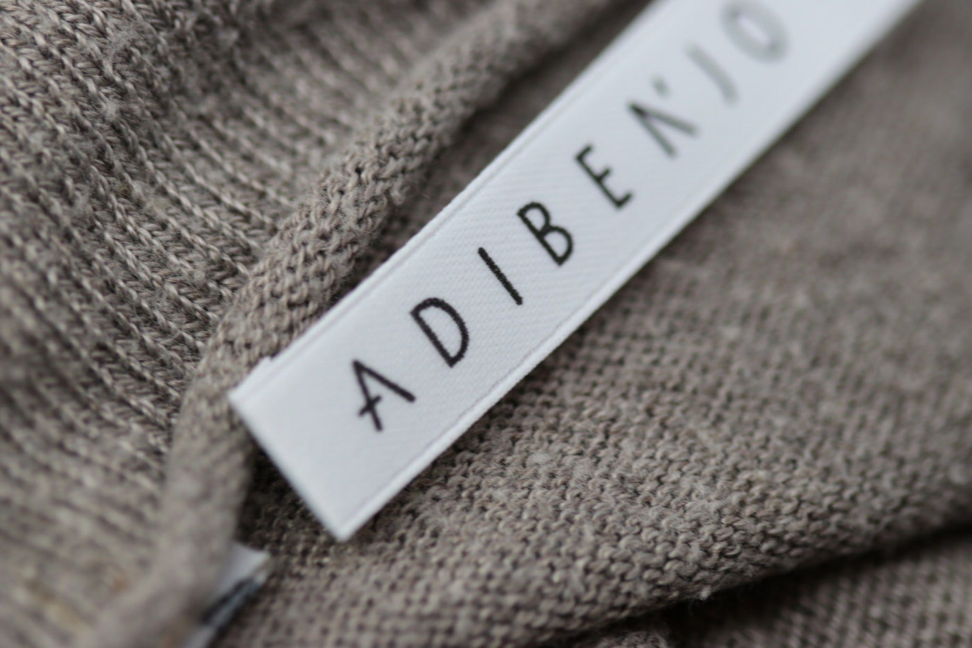 Satin labels to the back of the garment – NAS Online